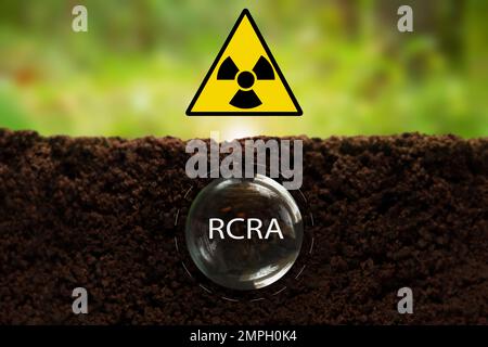 Transparent capsule underground on a green background. radioactive ...