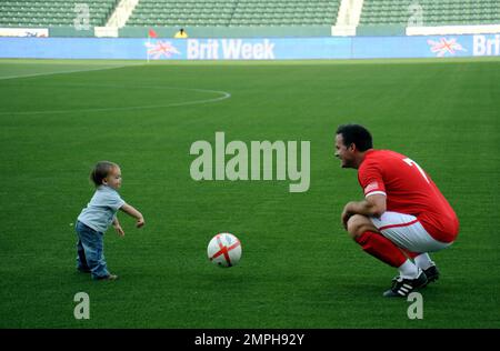 Eric Wynalda plays with his son at halftime at the BritWeek 2010 ...