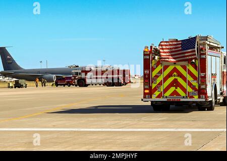 Two 507th Civil Engineering Squadron firetrucks sit on the flight line ...