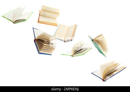 Colorful hardcover books flying on white background Stock Photo - Alamy