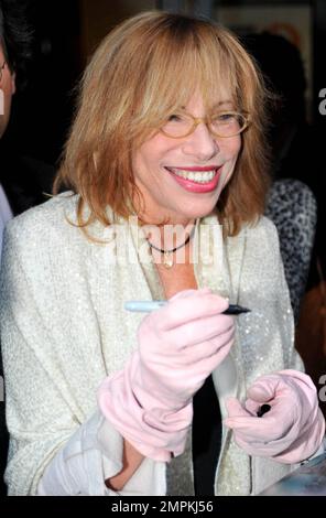 Singer/songwriter Carly Simon signs autographs as she leaves the BBC ...