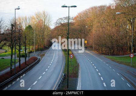 Twin two lane roads through small town shot from bride with aerial view ...