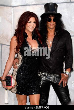 Slash and wife Perla Ferrar, who recently renewed their marriage vows ...