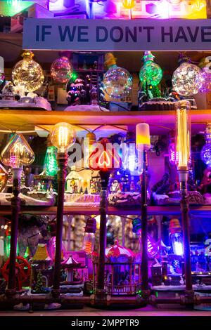 Colourful novelty light bulbs in a shop window display Stock Photo - Alamy