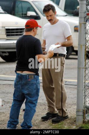David Arquette goes over some documents on the set of "Scream 4" In the ...