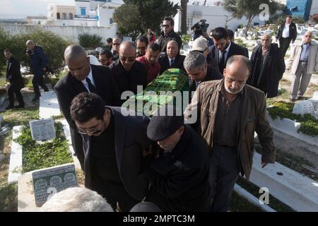 Relatives and friends of Tunisian-born designer Azzedine Alaia carry ...