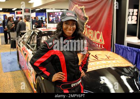 Dystany Spurlock poses for photos with her Number 57 race car ...