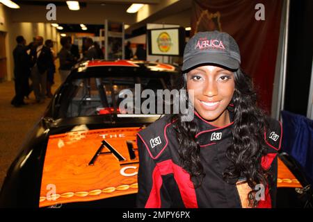 Dystany Spurlock poses for photos with her Number 57 race car ...