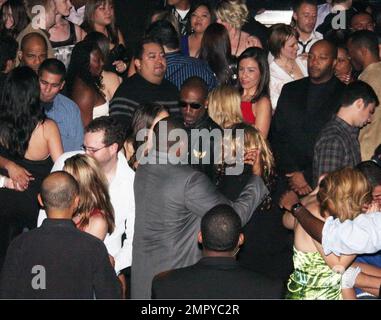 Actor Eddie Murphy enjoys being surrounded by a bevy of beauties during ...