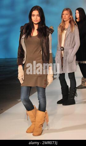Models pose on the runway at the EMU fashion show during Mercedes-Benz ...