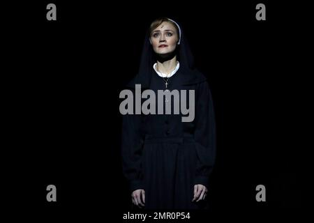 Carmen Pretorius of South Africa, who plays "Maria" sings with other ...