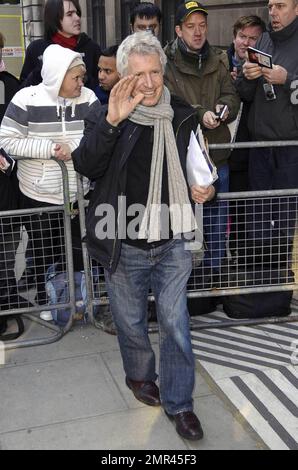 Veteran UK television star George Layton is all smiles as he waves and ...