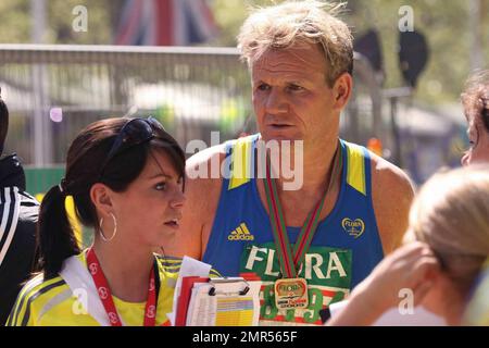 Gordon Ramsay shows off his medal after completing the Flora London ...