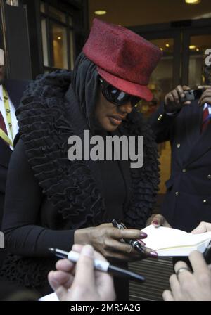 Grace Jones signs autographs for her loyal fans outside the BBC. As ...