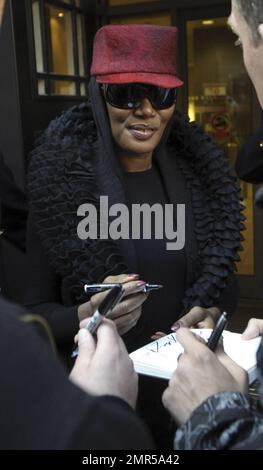 Grace Jones signs autographs for her loyal fans outside the BBC. As ...