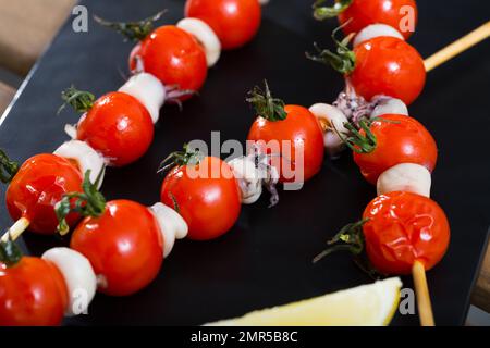 Mini calamari with cherry tomatoes grilled with olive oil and balsamic ...