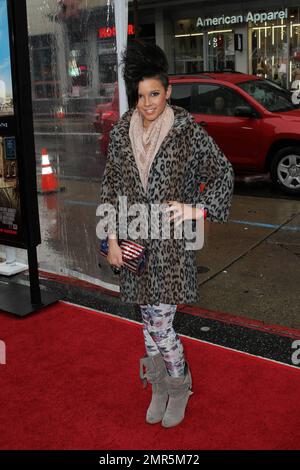Singer Manou Oeschger braves the rain and walks the red carpet at the ...