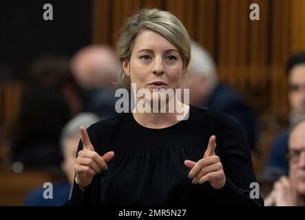 Foreign Affairs Minister Melanie Joly looks on as Prime Minister Justin ...