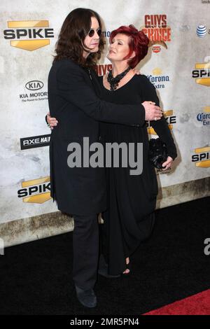 Ozzy Osbourne and Sharon Osbourne playful pose with parody glam-metal ...