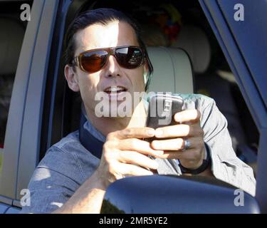 Gavin Rossdale takes some photos with his cellphone camera after making ...