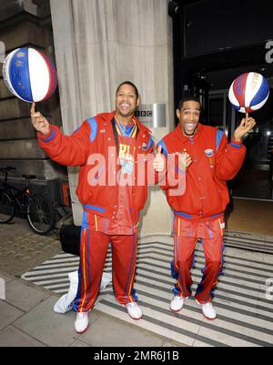 Two members of the world-famous Harlem Globetrotters show off thier ...