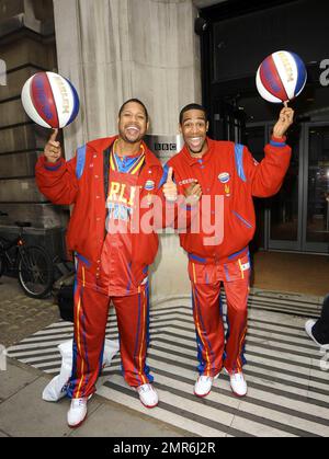 Two members of the world-famous Harlem Globetrotters show off thier ...