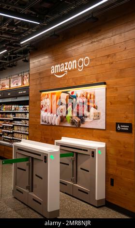 The entrance of the Amazon Go store where a scanner device let’s ...