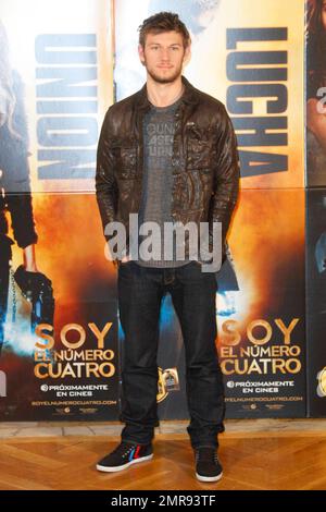 SPAIN OUT - With a scruffy beard and in a leather jacket Alex Pettyfer ...