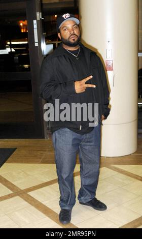 EXCLUSIVE!! Rapper Ice Cube flashes a peace sign as he poses for photos ...