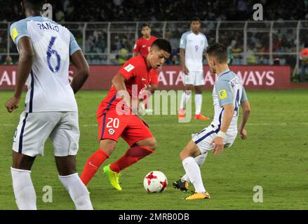 Chile's Jairo Vasquez duels for the ball against Iraq's Maytham Jabbar ...