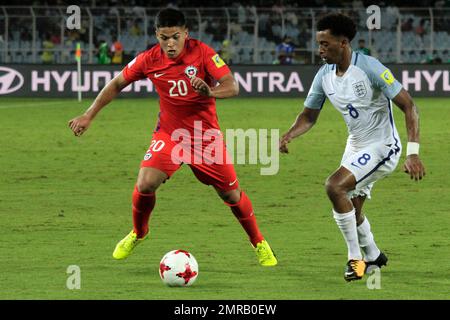 Chile's Jairo Vasquez duels for the ball against Iraq's Maytham Jabbar ...