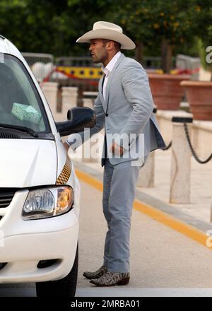 Jason Statham wears country western wear, complete with cowboy hat and ...