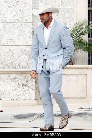 Jason Statham wears country western wear, complete with cowboy hat and ...