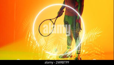 Low section of african american male tennis player with racket and ball ...