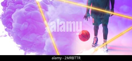 Low section of african american male player with leg on ball by ...