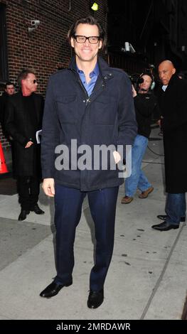 Actor Jim Carrey shows off his nerd glasses as he arrives at the Ed ...