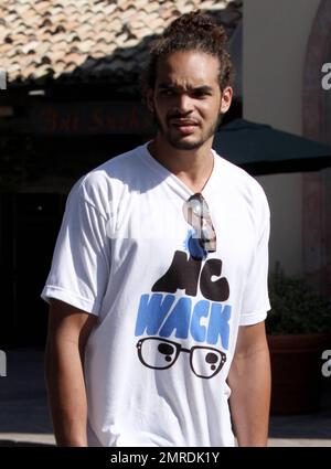 Joakim Noah of the Chicago Bulls holds up the legs of his shorts as he ...