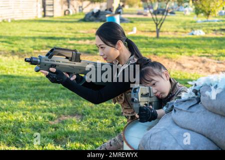 Happy mother and daughter playing cs Stock Photo - Alamy