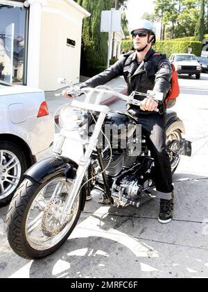 Biker dude Justin Timberlake hops on his big black motorcycle and heads ...