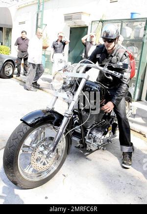 - Biker dude Justin Timberlake hops on his big black motorcycle and ...