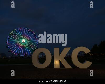 Stationary Wheeler Park ferris wheel lit with rainbow color neon lights ...