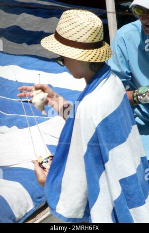 Katy Perry shows off her figure in a green bikini during a break with ...