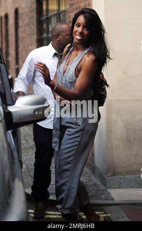 Kelly Rowland is all smiles as she waves to photographers while leaving ...