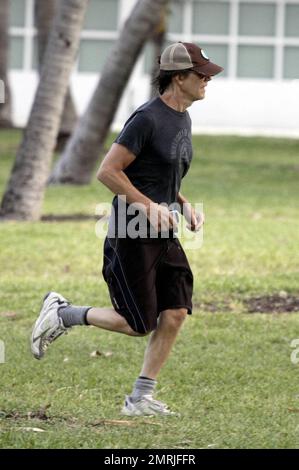 Actor Kevin Bacon gets in some jogging along the beach in Miami's ...
