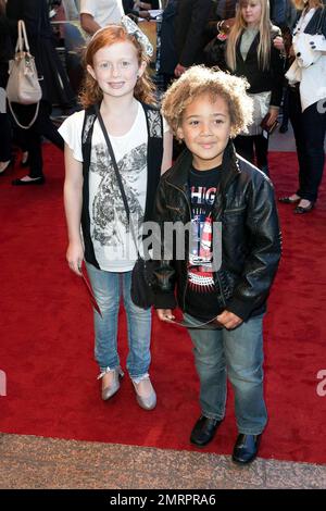 Maisie Smith and Devon Higgs pose for photographers on the red carpet ...