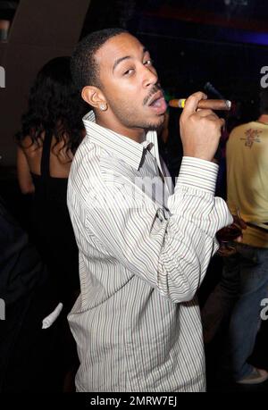 EXCLUSIVE!! Rapper Ludacris enjoys a cigar and a drink while partying ...