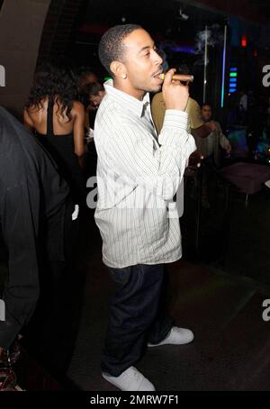 EXCLUSIVE!! Rapper Ludacris enjoys a cigar and a drink while partying ...