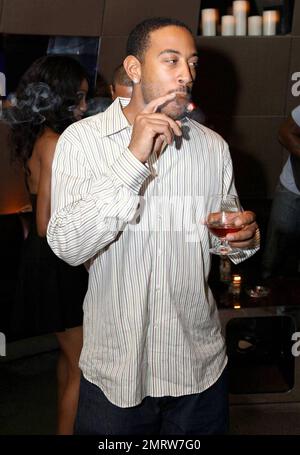 EXCLUSIVE!! Rapper Ludacris enjoys a cigar and a drink while partying ...