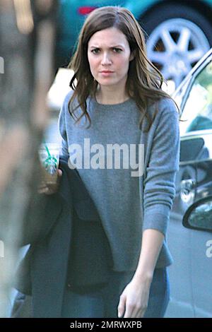 EXCLUSIVE!! Wearing a grey sweater and sipping a drink from Starbucks ...