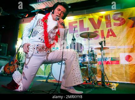 Elvis impersonator Tatsuro Nagata of Japan performs during the finals ...
